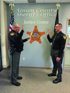 Both sides of the badge - Marysville Journal Tribune
